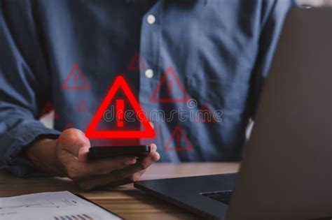 Businessman Using Smartphone With Warning Signnotification Error And Virus Detection Spyware