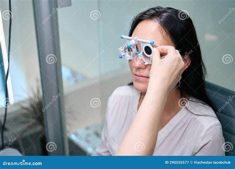 Ophthalmologist Conducting Monocular Subjective Refraction On Client