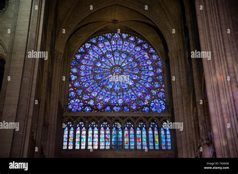 The Stained Glass Rose Window Of Notre Dame Cathedral In Paris France
