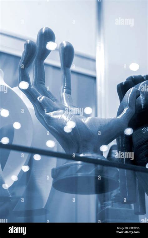 art object printed on 3d printer prototype hand with fingers of blue