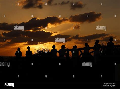 People Watch A Setting Sun At Yonaguni Jima Island In Okinawa Prefecture On Sep 9 2022 The