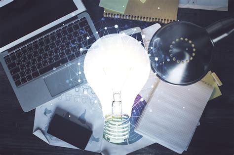 Premium Photo Bulb Drawing Over Computer On The Desktop Background