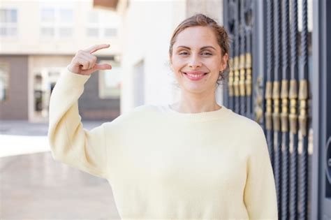 Premium Photo Holding An Object Showing Offering Or Advertising