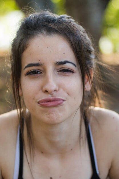 Premium Photo Portrait Of Beautiful Young Woman Making Face While