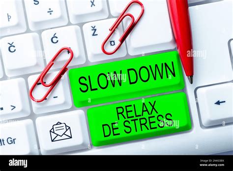 sign displaying slow down relax de stress word for have a break reduce