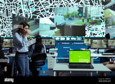 Shipping Agency Workers Examine Satellite Map Next To An Isolated