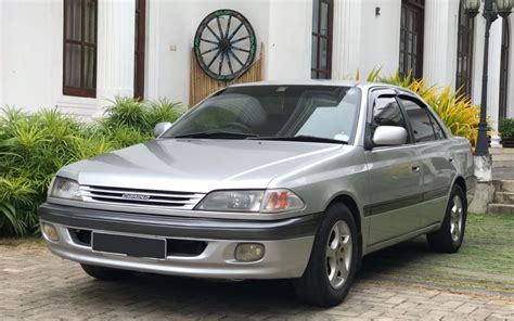 Toyota Carina vs Porsche Cayenne - Features & Specs Comparison | CarsGuide