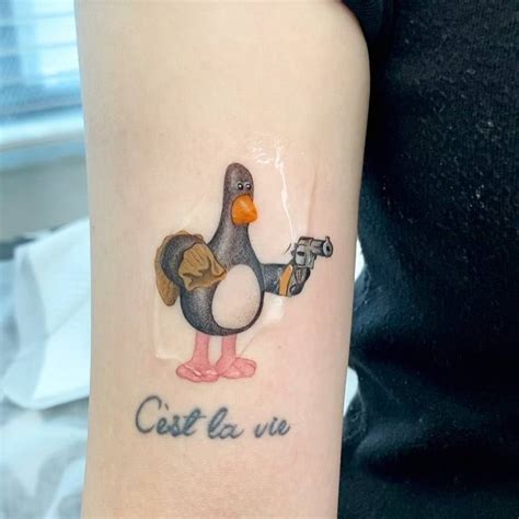 Feathers Mcgraw Tattoo Located On The Bicep
