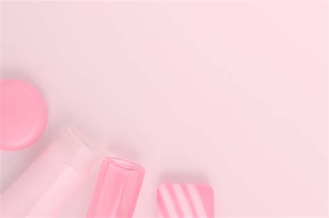 미용 및 스킨 케어 메이크업용 화장품 메이크업 리무버 물과 콜라겐과 리프팅 효과와 크림을 보습 하 고 영양 크림 튜브 립 밤 카피 스페이스와 핑크 배경에 천연 비누 0명에