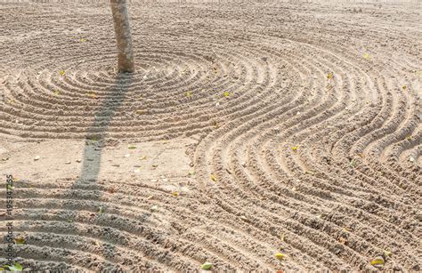 Simple Spiritual Patterns In A Japanese Zen Garden With Lines Raked
