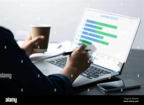 Business Data Analysis On Laptop Financial Charts Graphs Reports For