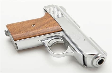 Davis Industries Model P32 Semi Automatic Pistol In 32 Acp Caliber Showing Nickeled Finish And Comp