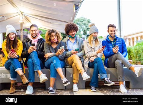 Multicultural Group Of Friends Using Smart Mobile Phones App Teenagers