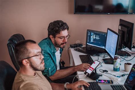 programmers engrossed in deep collaboration diligently working