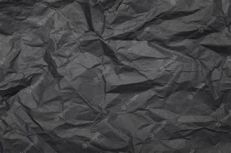 어두운 구겨진 종이 오래 된 회색 바탕 화면 배경 프리미엄 사진