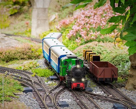 Set Of Red Electric Model Railway Locomotive And Layout With A Station And Whole Scene With