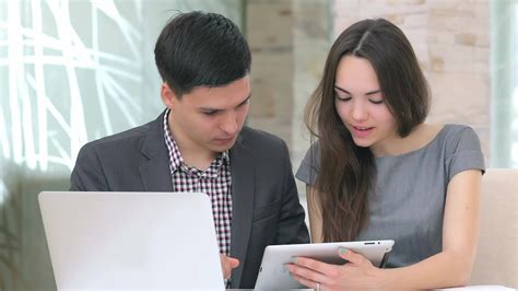 Discussing Collating Data On The Tablet 34772443 Stock Video At Vecteezy