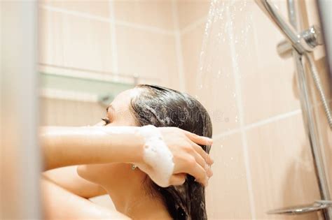 Beautiful Naked Young Woman Smiling While Taking Shower Stock Image
