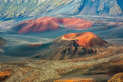 Haleakalā National Park Offers A Sunrise Above Clouds Overlooking A
