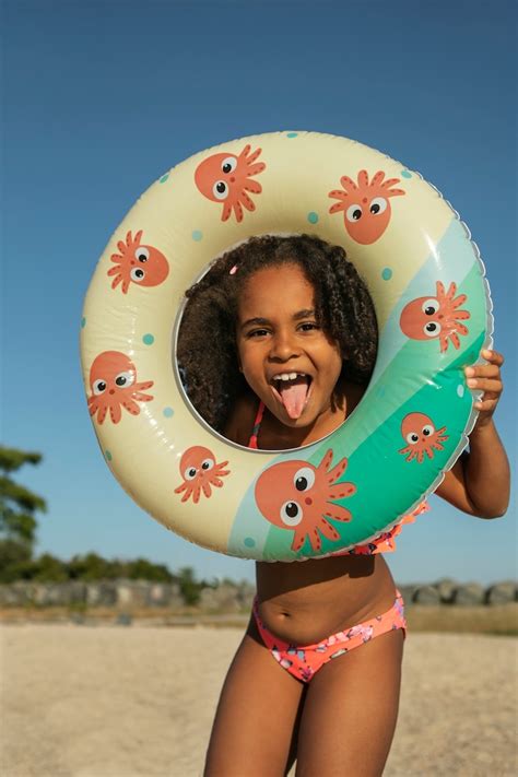 Free Photo Front View Smiley Girl On Beach
