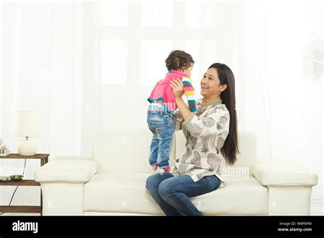 Mother Playing With Her Baby Stock Photo Alamy