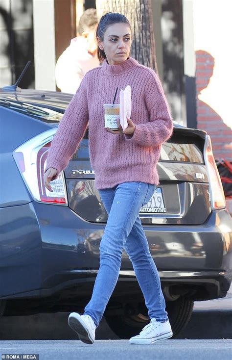 Mila Kunis embraces her casual style in pink sweater and denim as she heads out for a coffee run ...