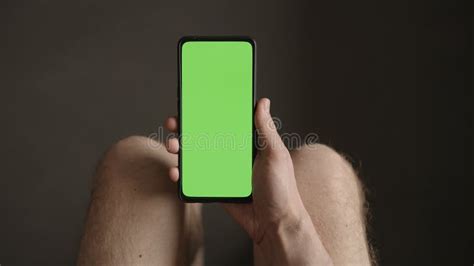 Man Using Phone With Green Screen While Sitting With Naked Legs Stock Photo Image Of Sitting