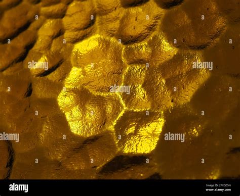 Golden Yellow Corrugated Glass With A Light And Dark Background Reflections Of Light