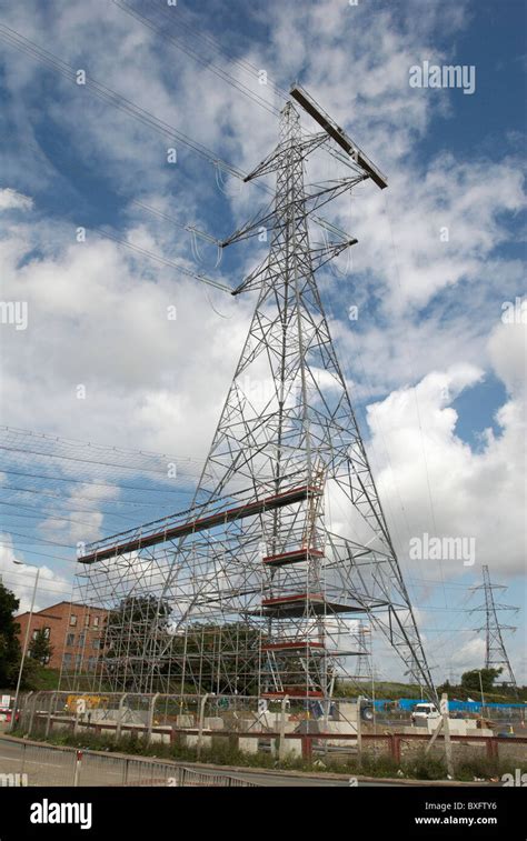Scaffolding Erected Around Pylon And Power Lines East London Uk Stock Scaffolding Erected Around Pylon And Power Lines East London Uk Stock