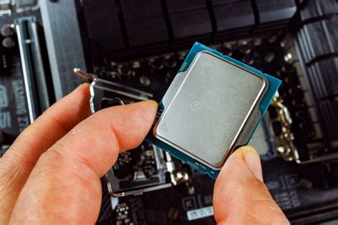 assembly process of a desktop computer involves technician plugging cpu into motherboard socket