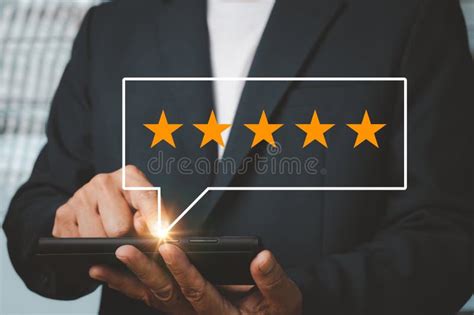 Hand Business Man Analyzing The Questionnaire And Combining The Satisfaction Score With Five