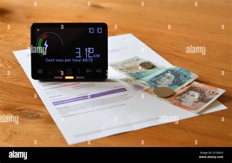 Electricity Smart Meter In Home Display Ihd On Wooden Table Showing Current Usage In Kilowatts