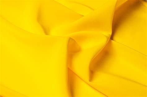 배경 텍스처입니다 템플릿입니다 실크 직물은 짙은 노란색 이다 특히 분위기에 대 한 만든 좋은 품질의 실크 매력 무게중간 절묘 한 휘장과 아름 다운 광택 0명에 대한 스톡