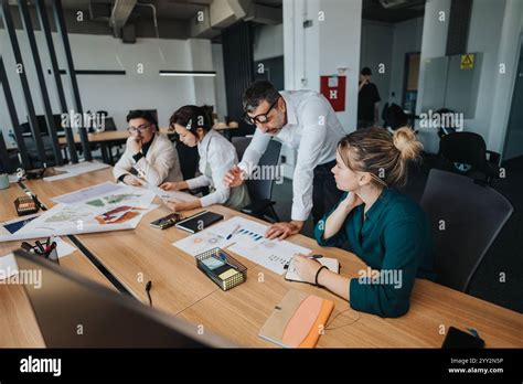 Business Team Brainstorming And Strategizing At Modern Office Meeting