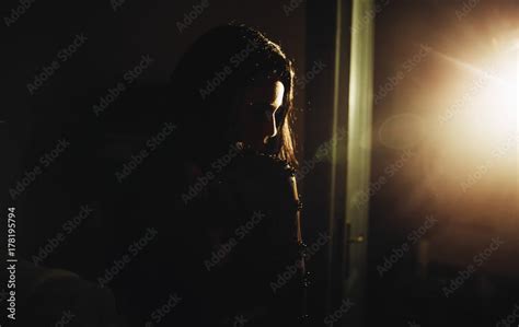 Beautiful Sensual Woman In The Dark Room Stock Photo Adobe Stock