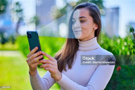 Modern Woman Scans Face Using Facial Recognition System On New