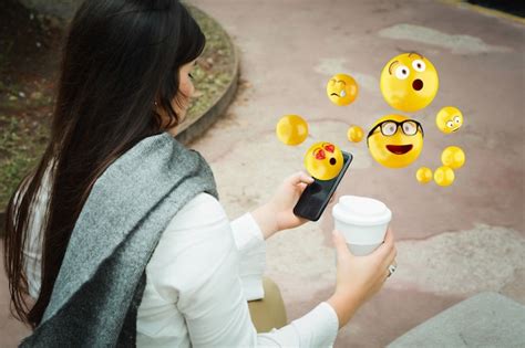 premium photo woman using smartphone sending emojis