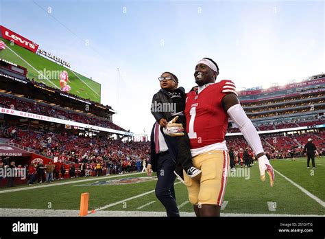 San Francisco 49ers Holds His Son Tyshun Before An Nfl Football Game