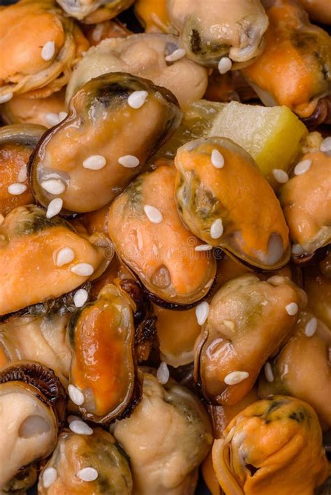 Delicious Marinated Mussels With Spices And Herbs On A Ceramic Plate