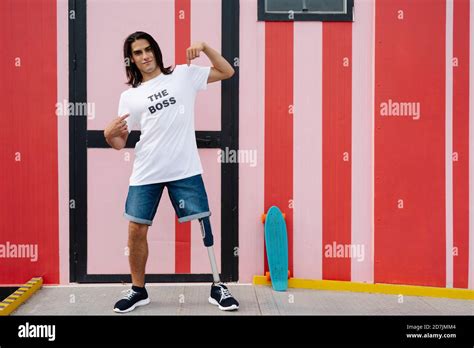 Man Pointing Himself While Standing Against Multi Colored Wall Stock Photo Alamy