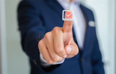 businessman hand touching virtual checkmark button success confirmation