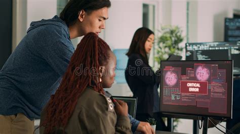 diverse team of database admins having hacked server and security