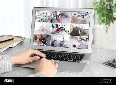 Woman Monitoring Modern Cctv Cameras On Laptop Indoors Closeup Home Security System Stock