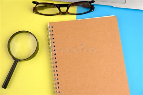 Home Office Workspace Mockup With A Notebook And Yellow And Blue