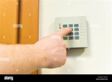 Man Introduces Code On Access Panel Stock Photo Alamy