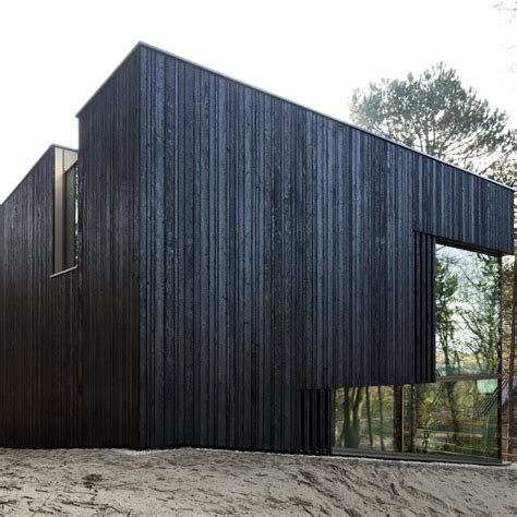 Charred Timber And Glass Villa By Vvkh Architecten Is Embedded In A Dune