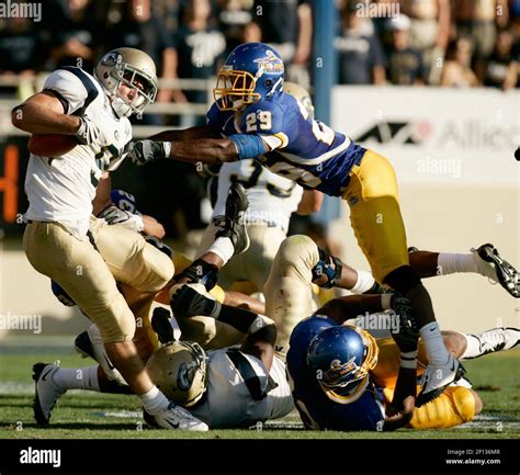 Uc Davis Running Back Joe Trombetta 9 Slips Away From San Jose State Center Back Christopher