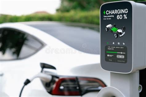 Closeup Ev Charger Plug Handle Attached To Electric Vehicle Port