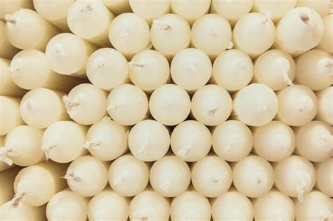 Premium Photo Stack Of White Candles Create A Visual Pattern