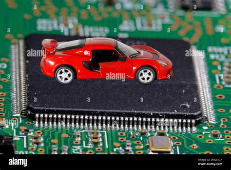 The Red Car Stands On The Microprocessor The Concept Of A Shortage Of Chips In The Automotive